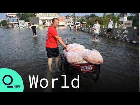 Volunteers Deliver Emergency Supplies to China's Flood-hit Xinxiang ...