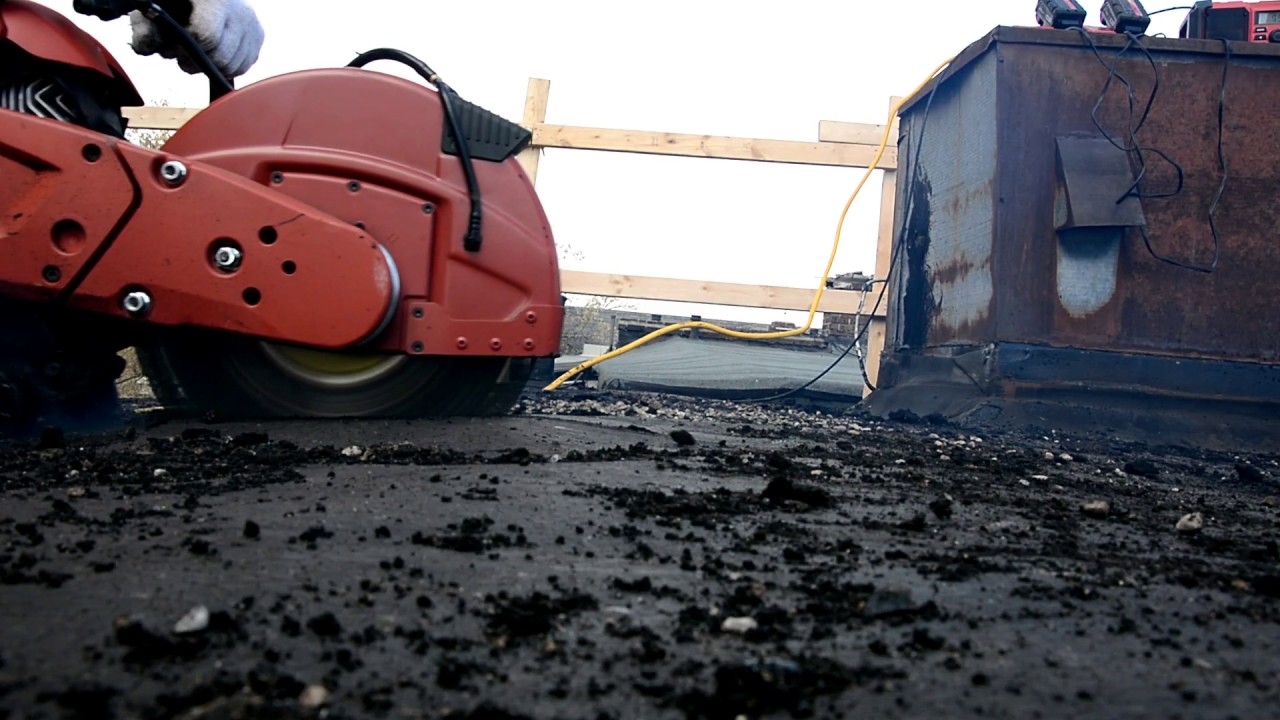 Cutting into a flat roof on Danforth with a Hilti DSX-700 cutter saw ...