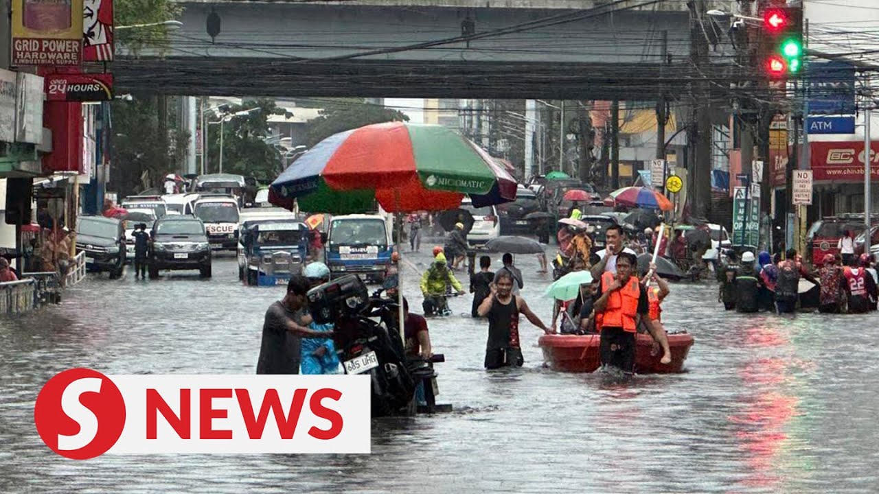 Heavy rains from Typhoon Gaemi render Manila streets underwater - YouTube