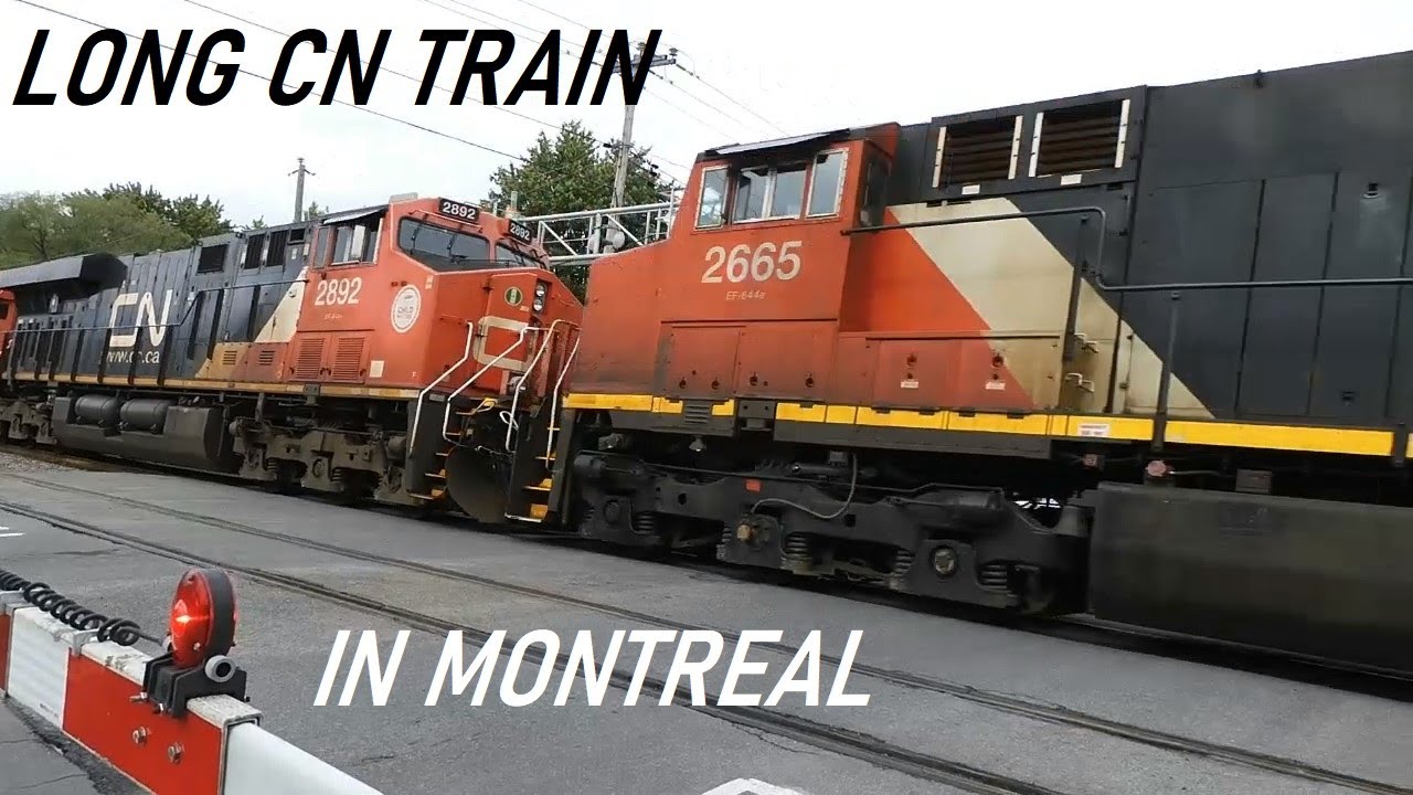 6 13 23 LONG CN TRAIN IN POINTE AU TREMBLES MONTREAL - YouTube