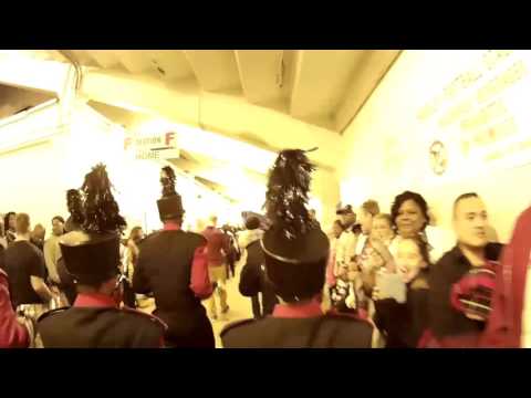 2015 Muskegon High School marching band and Alumni march in tunnel ...