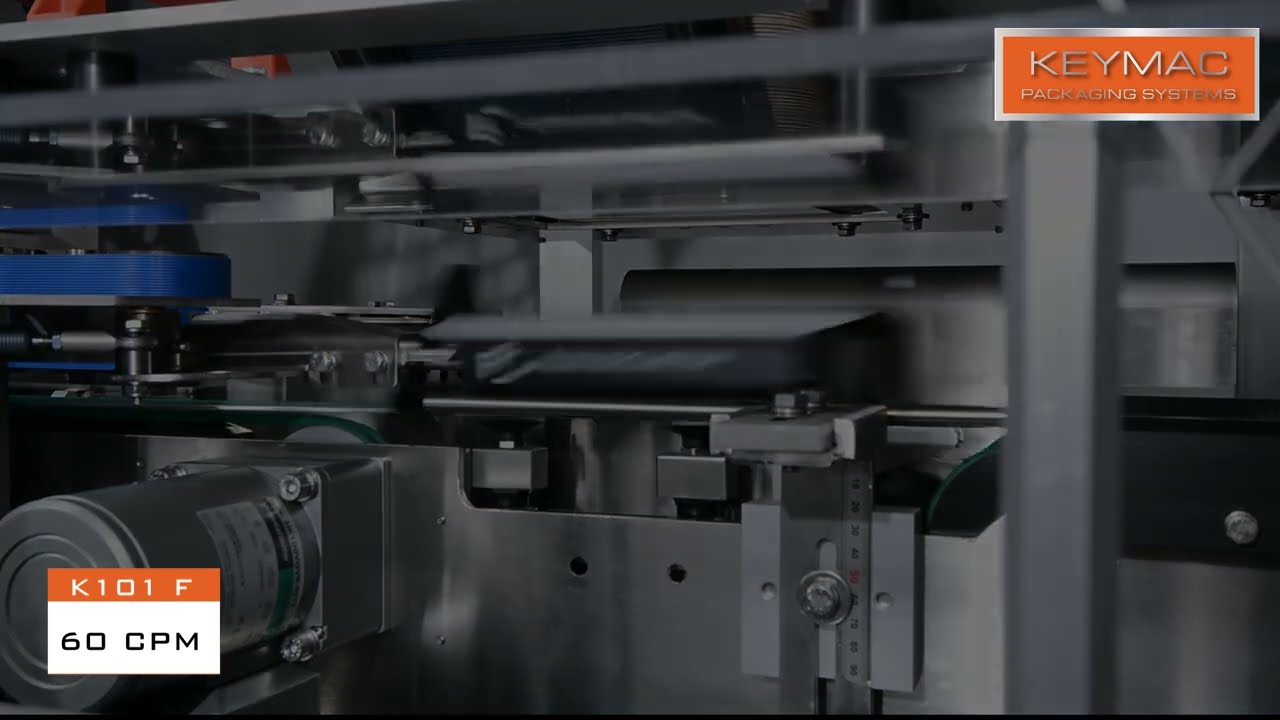 KEYMAC K101 F AUTOMATIC PRE-GLUED SLEEVER - YouTube