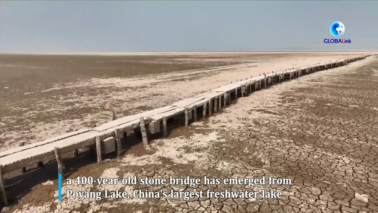 Drought makes 400-year-old stone bridge surface from lake in China ...