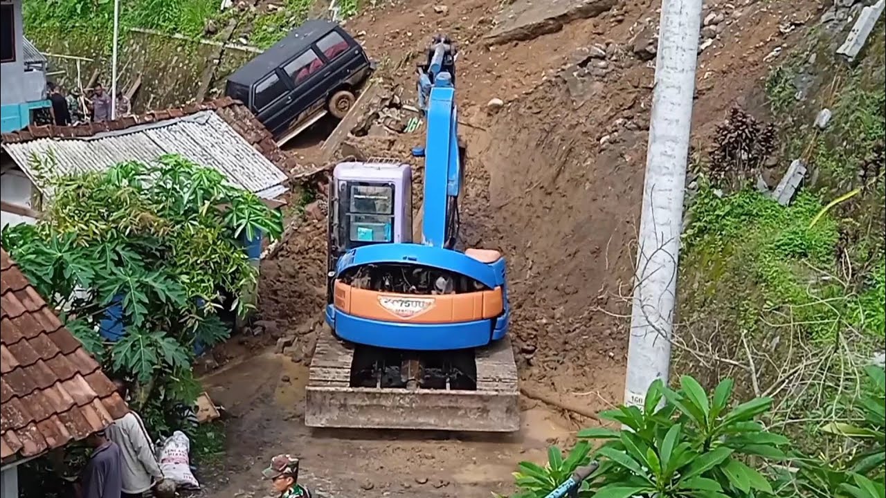 Process of Cleaning Landslide Material Using a Mini Excavator. - YouTube