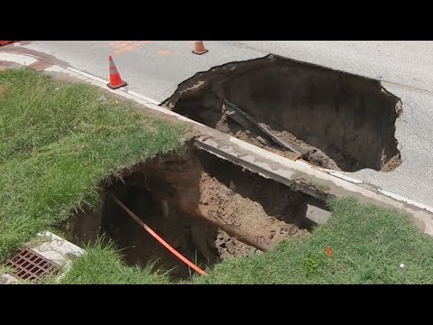 Huge sinkhole appears in Houston; repairs underway - YouTube