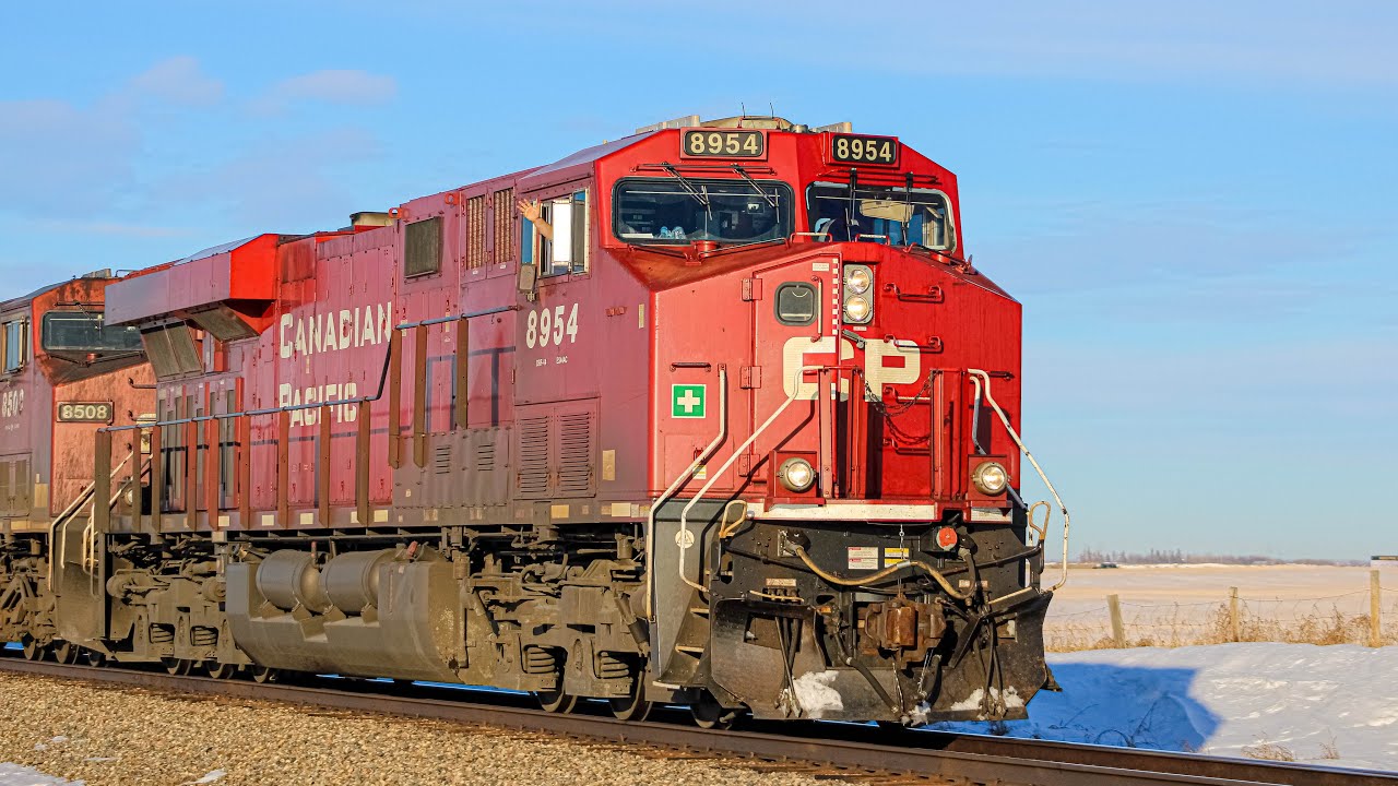 Nice crew! CP 8954 leads train 602 at Indus AB - YouTube