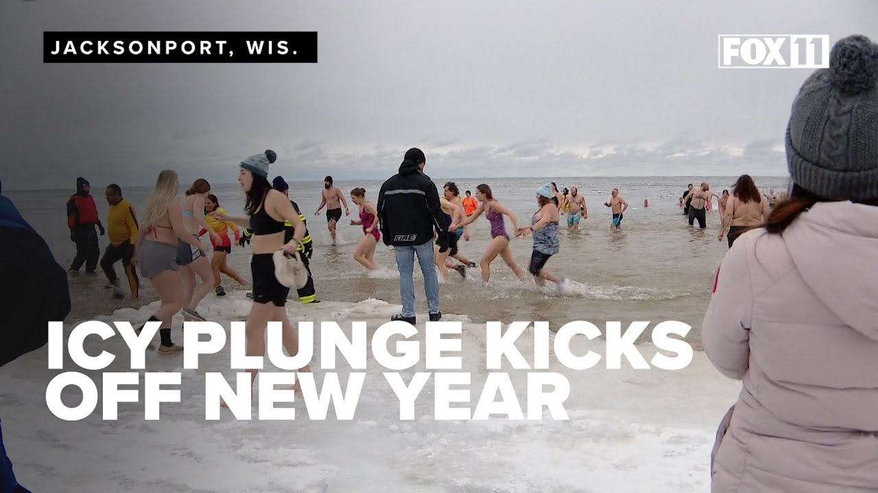Polar bears welcome 2026 with annual plunge in Jacksonport - YouTube