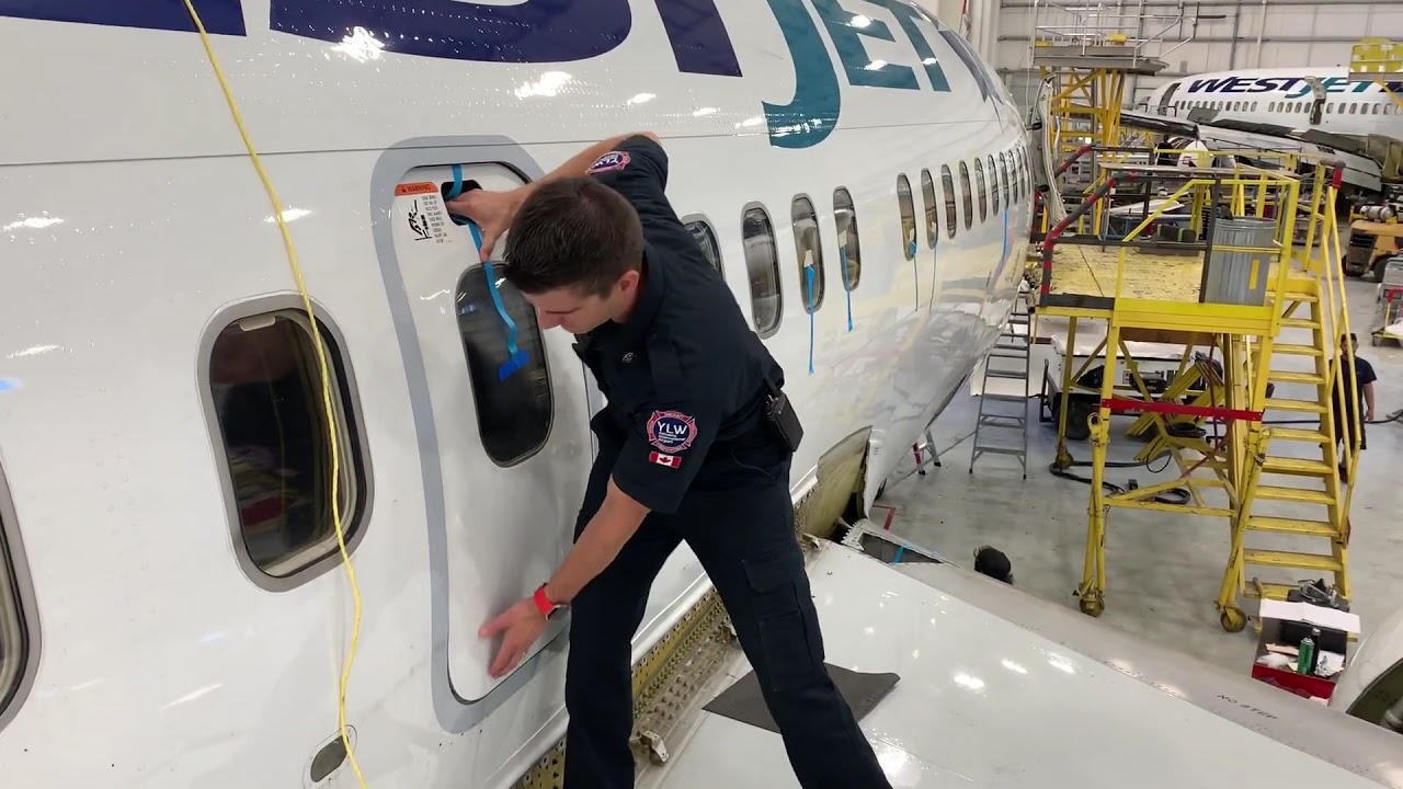 ARFF Training - 737 700 over wing exit - YouTube