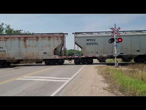 A super long empty sand train roars through Dufrense, Manitoba, on Sunday, August 18th, 2024 ...