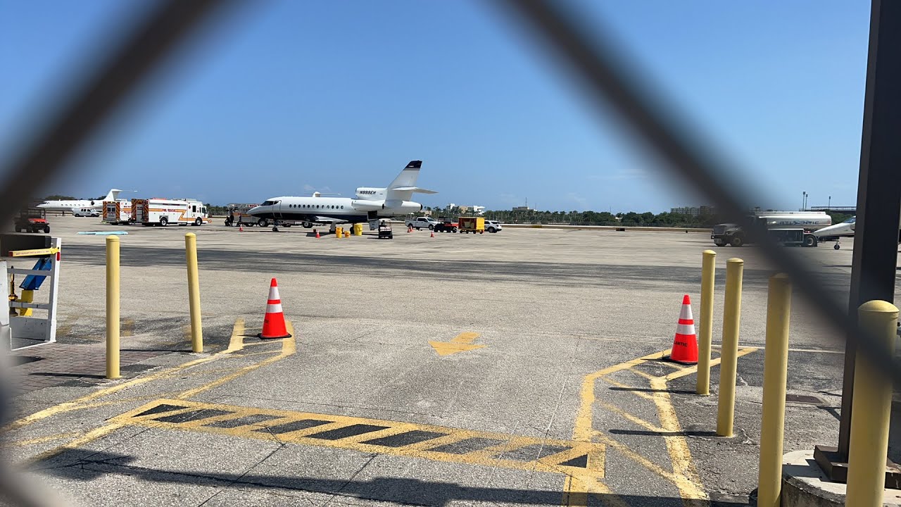 Airplane At Boca Raton Airport Dumping Fuel On Runway. Fire Department ...