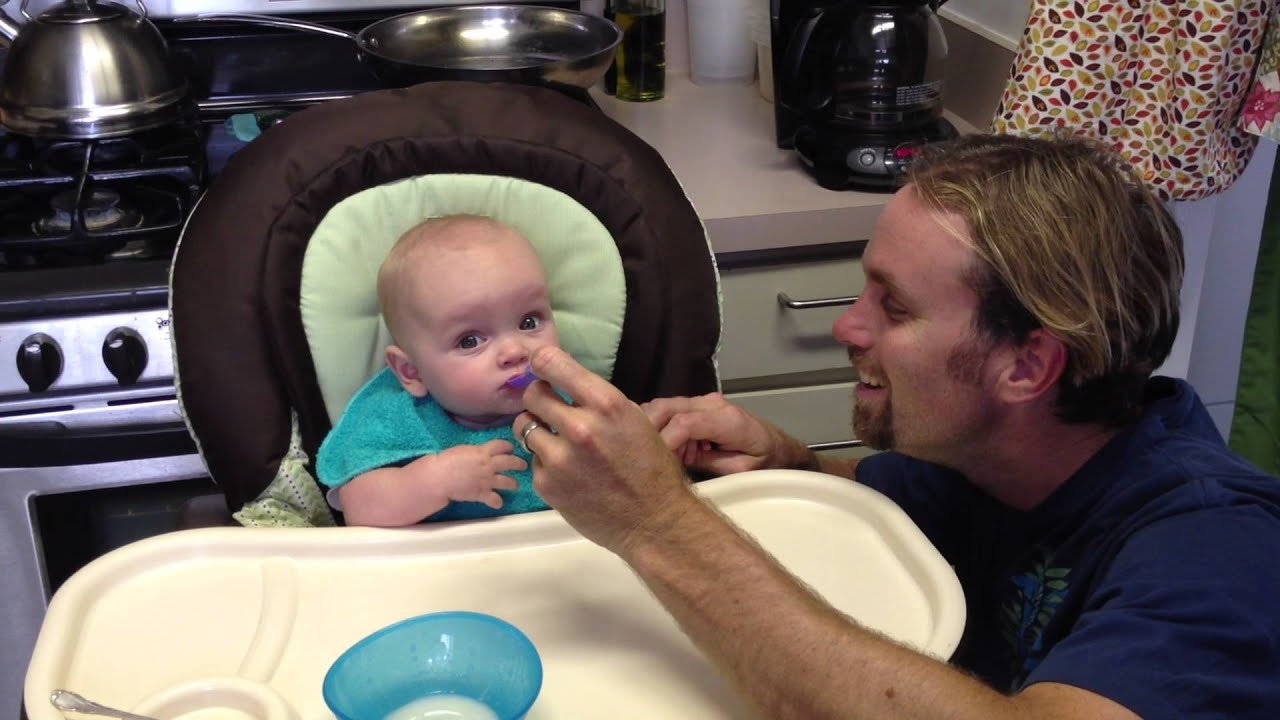 first solid food, rice cereal, with Daddy - YouTube