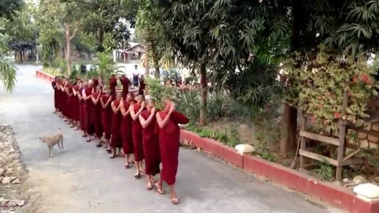 Shwe Kyin monastery in Mandalay Burma. February 2014. Monks gathering ...