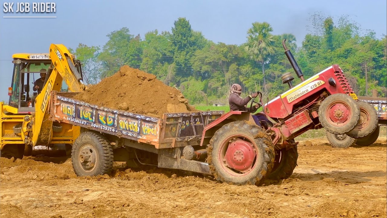 Jcb 3dx Backhoe Loader Machine Loading Red Mud In Mahindra 475 Di ...