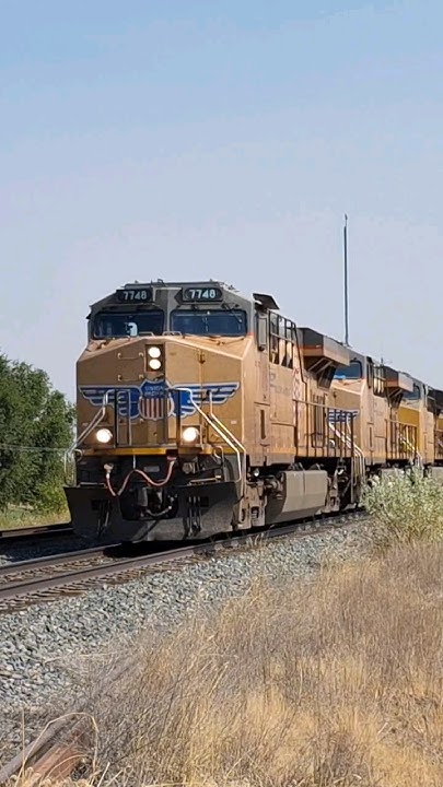 Awesome engineer on an eastbound UP intermodal as it takes the siding ...
