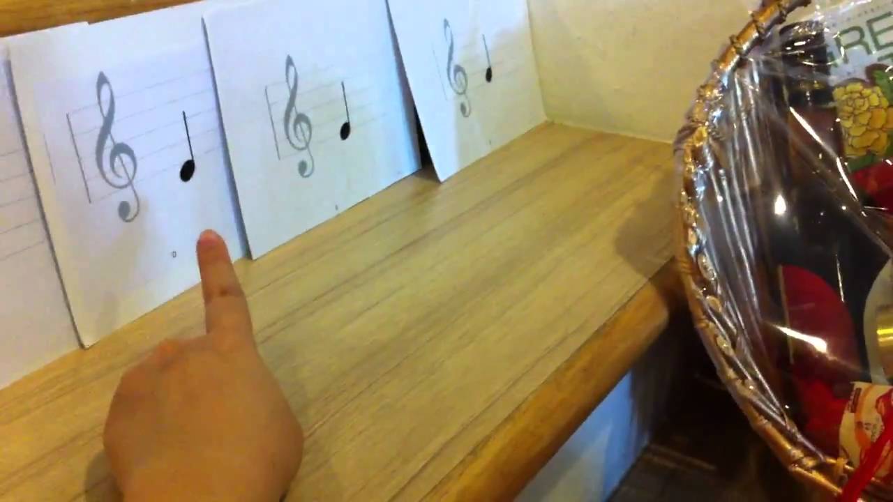 Toddler reading and playing music notes - YouTube