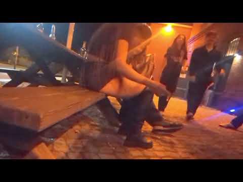 Candid Girl in Leather Overknees smoking cigarette and crushing it under her boots