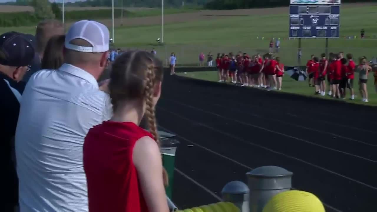 Evelyn Gurney honored at Reedsburg Track and Field meet - YouTube
