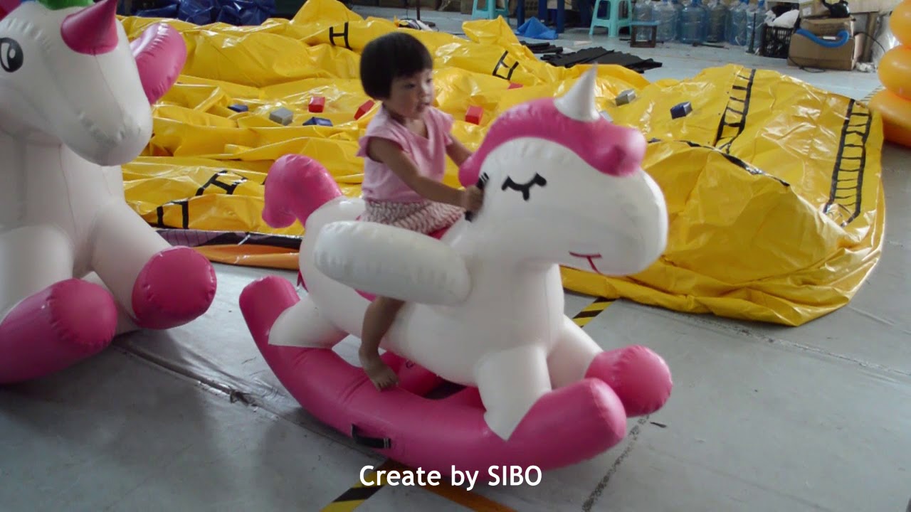 Guangzhou SIBO kids play toys riding inflatable rocking horse - YouTube