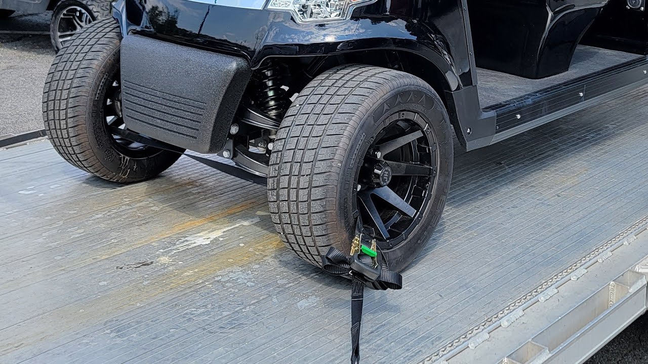 Another method strapping securing a golf cart to a trailer for ...