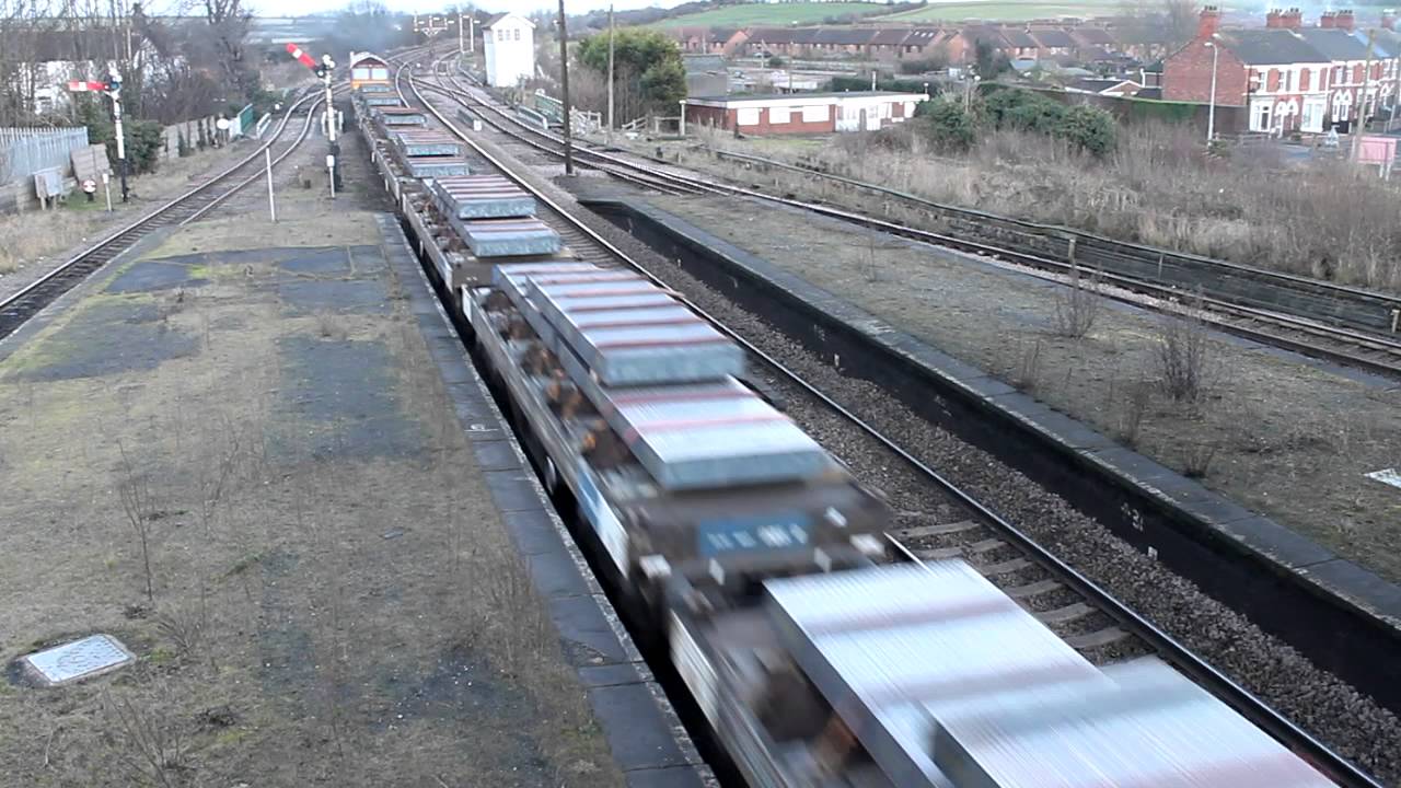 DB class 66164 passes with loaded steel wagons - YouTube