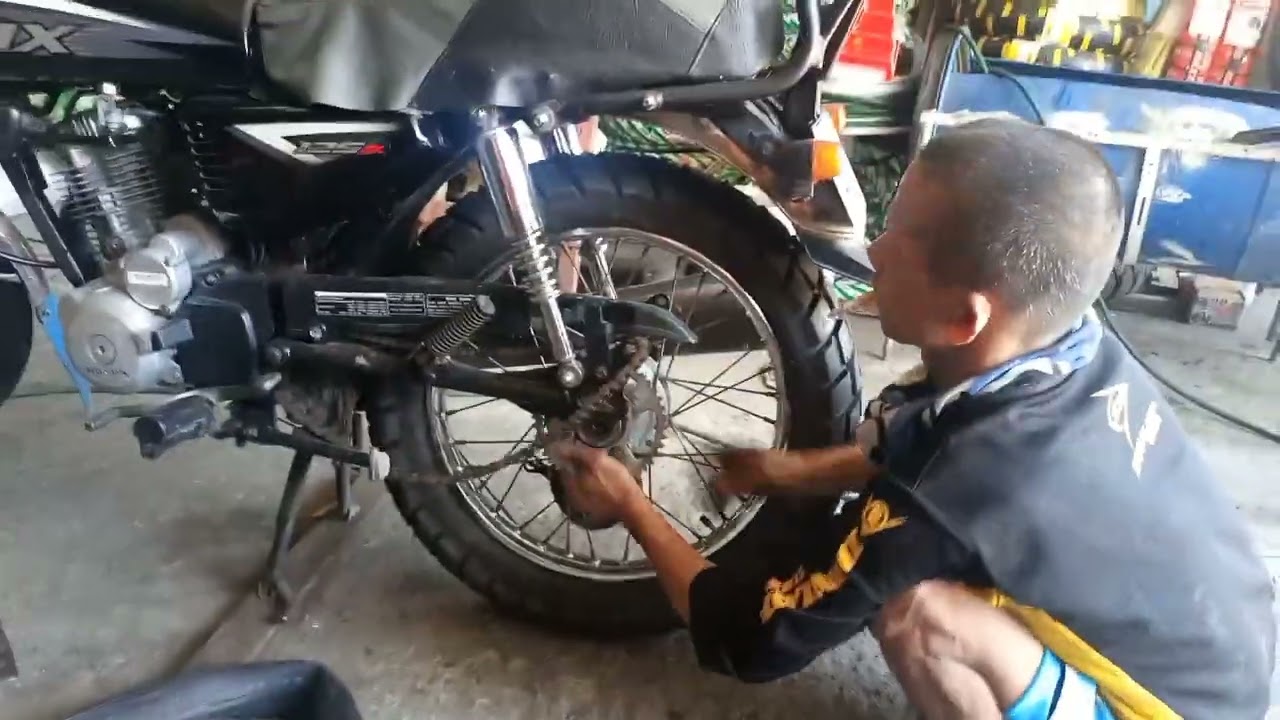 installing leo raptor 4.10x18 in rear tmx125 all stock. part2 - YouTube