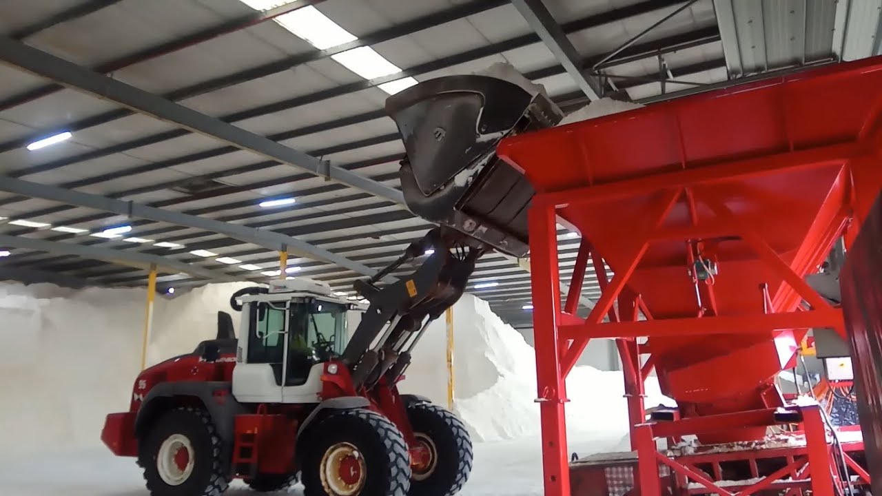 Volvo L120H salt handling and loading ship with conveyor belt - YouTube