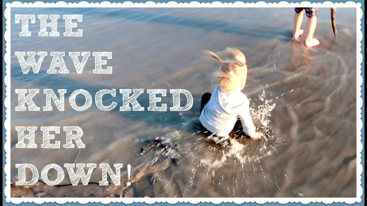 Toddler Gets Knocked Down By A Wave! - YouTube