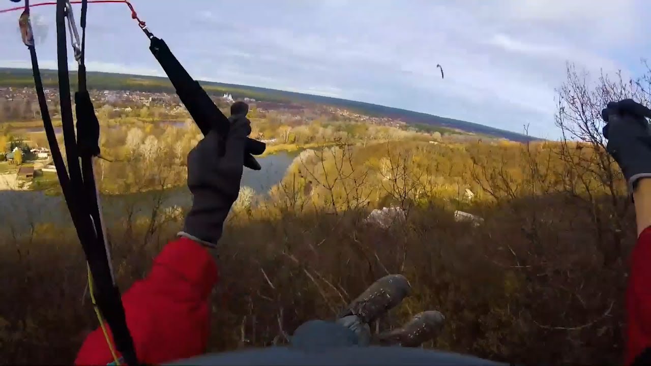 A Triumph Paraglider Breaks Free From Trees And Lands Into The River ...