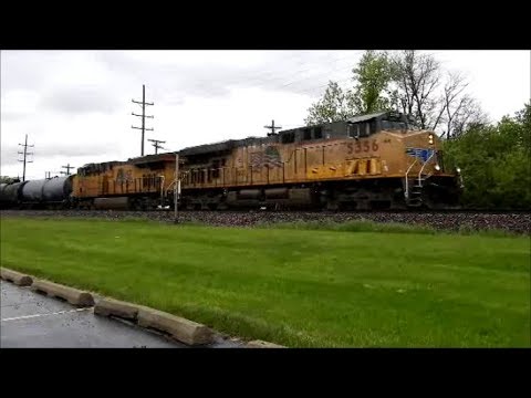 UP 5356 and UP 8142 lead a manifest with UP 2523 as a mid train DPU east in Geneva IL - YouTube
