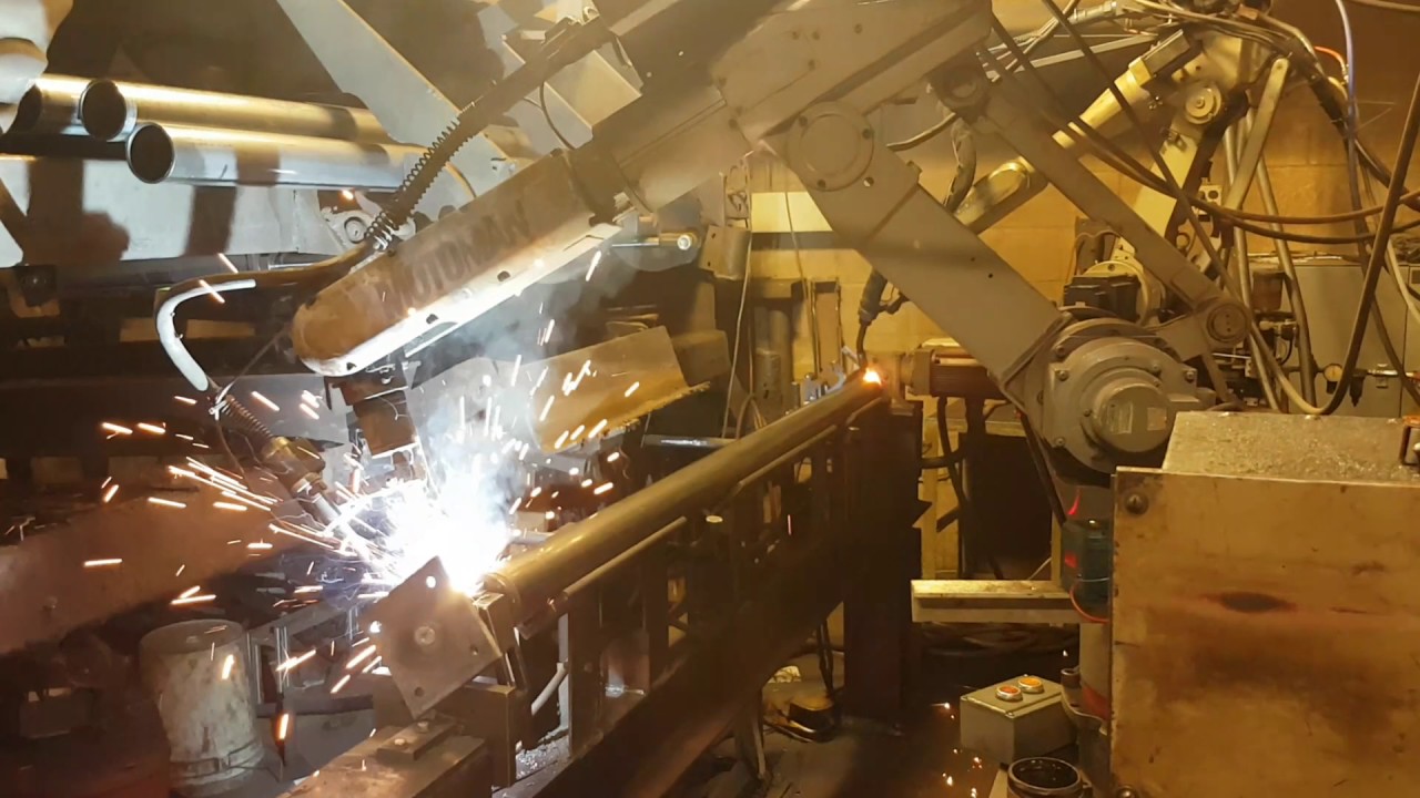 Robots welding rotating pipe for adjustable steel columns. - YouTube