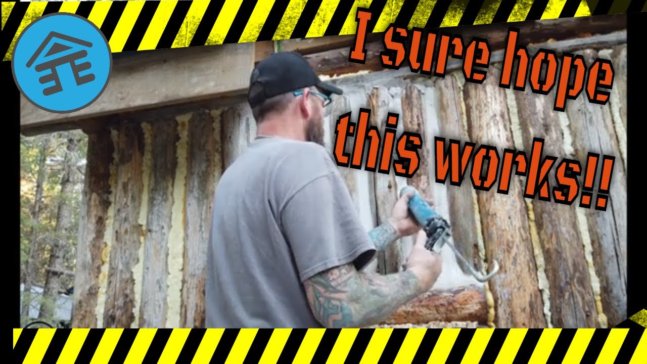 Chinking the Log cabin with a caulking gun - YouTube