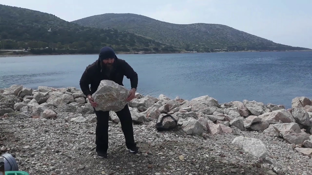 Strongman training outdoors, natural stone lifting. - YouTube