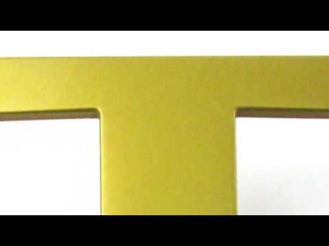 Letter T gold coloured anodized aluminium