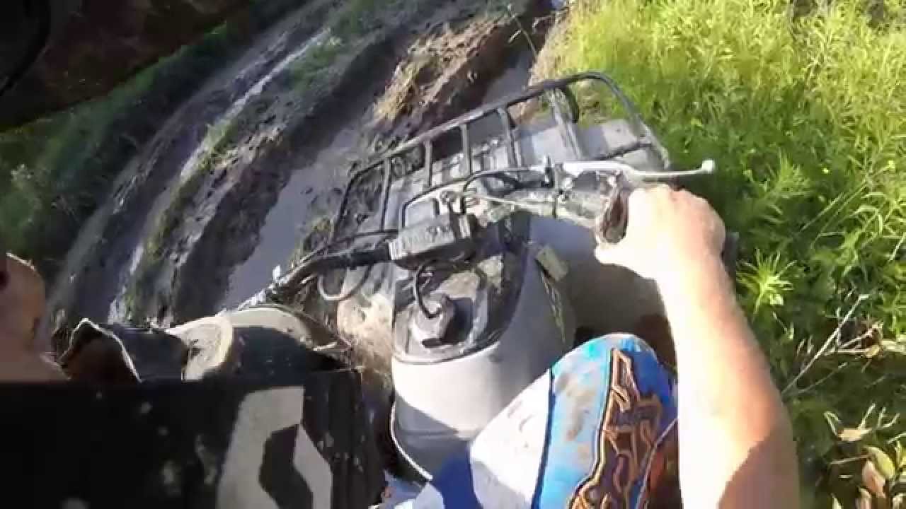 ATV Flips over with 2 people on it - YouTube