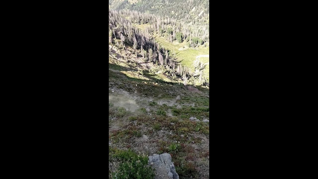Huge rock explodes from falling down the mountain - YouTube