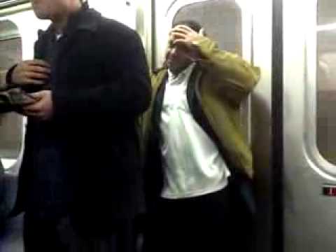 Man on subway breaks up a fight while having a snack. - YouTube