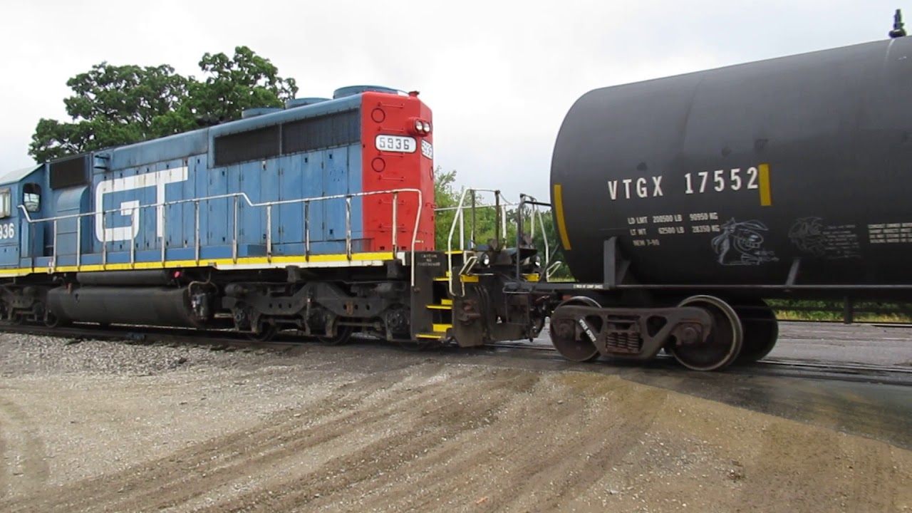 GTW 5936 pulls tank cars, box cars, and center beams out of Pavilion ...