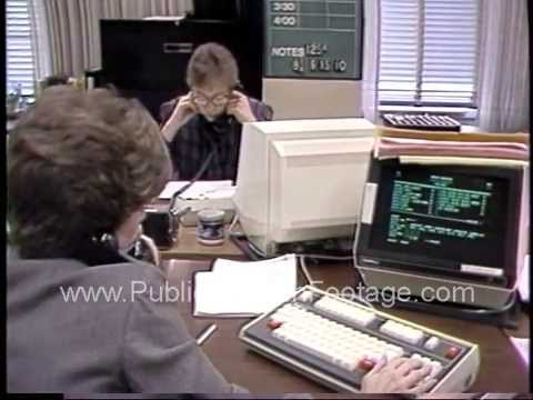 Female office workers on phone and computer early 1990's stock footage ...