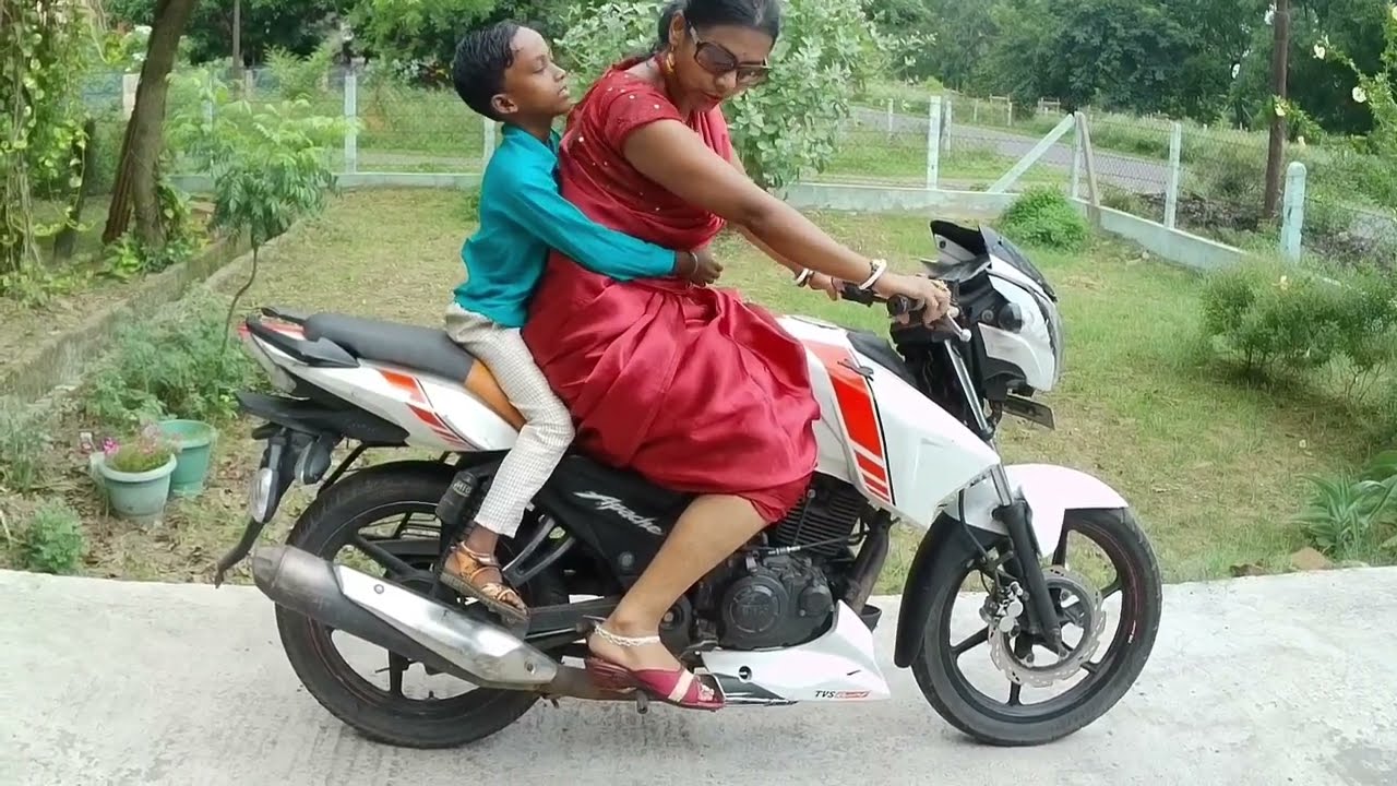 TVS Apache 180 cc bike riding wearing satin saree with a kid - YouTube