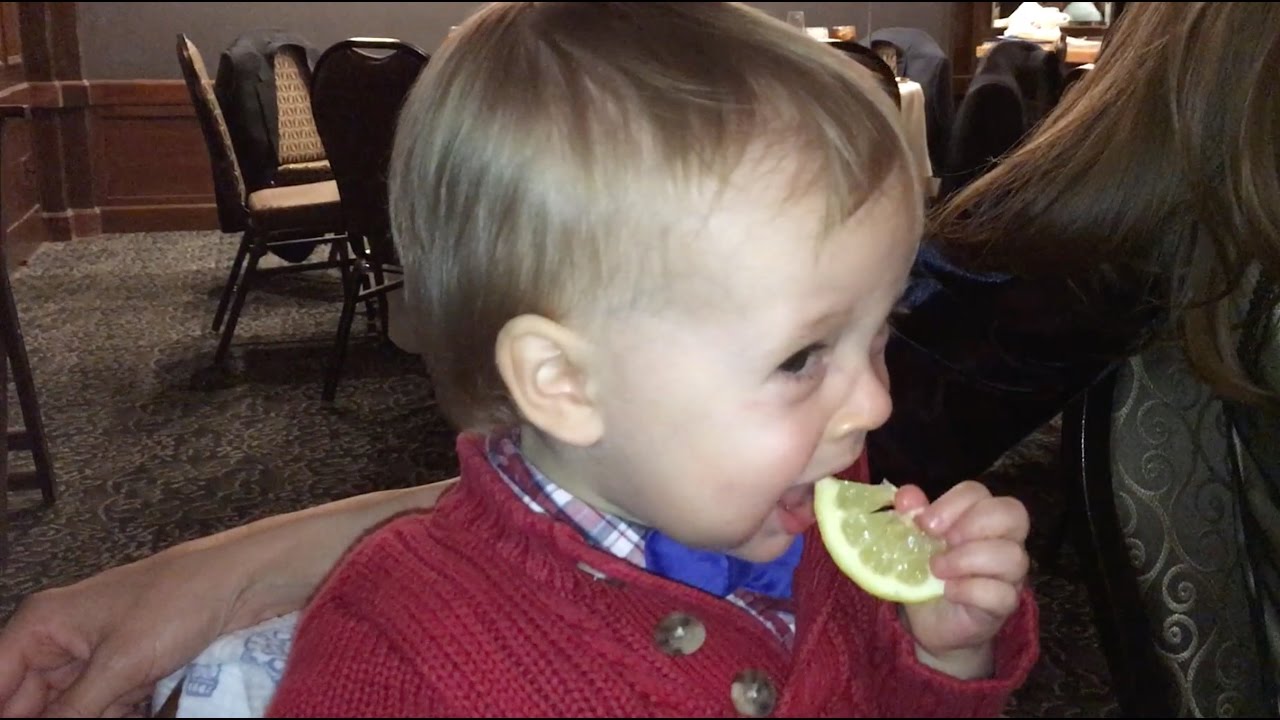 Baby tries lemon for the first time - YouTube