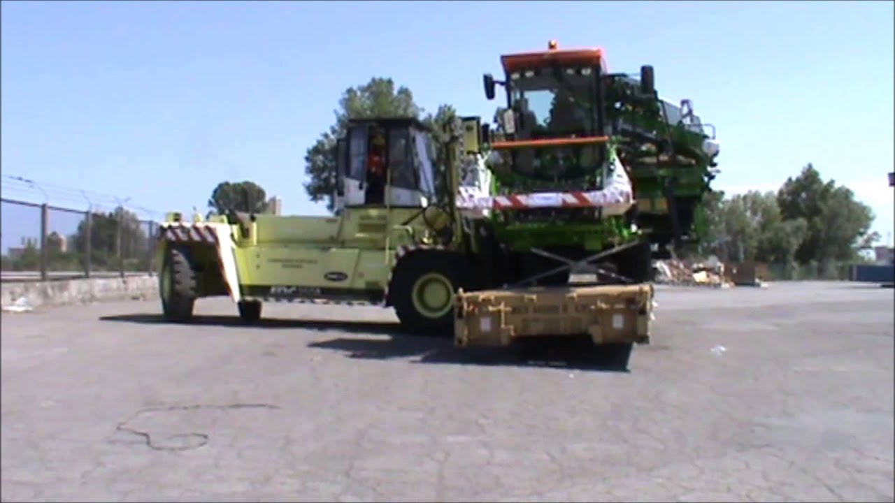 Tomato harvester raised by a mega forklift. - YouTube