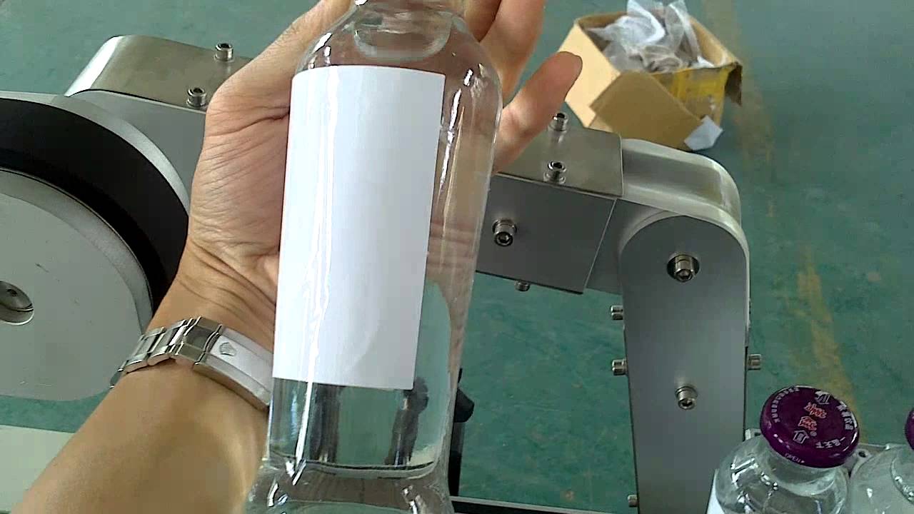 cone bottle labeling machine - YouTube
