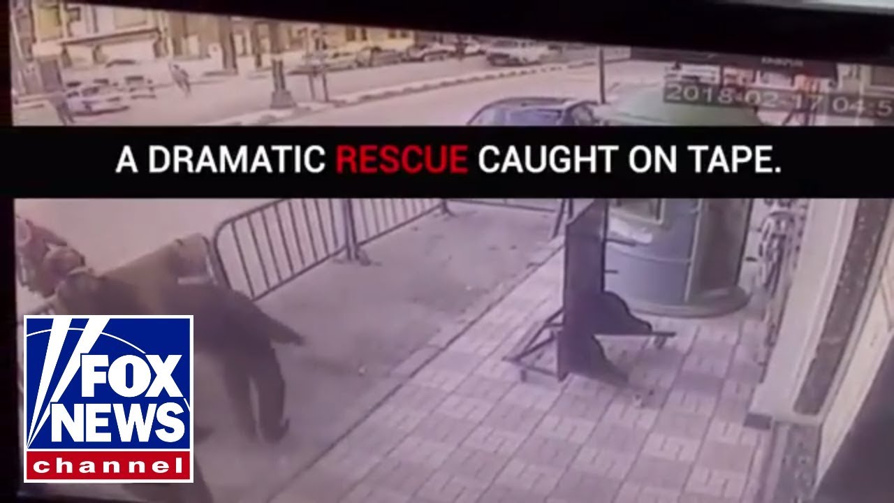 Dramatic rescue: Police catch falling child from third floor - YouTube