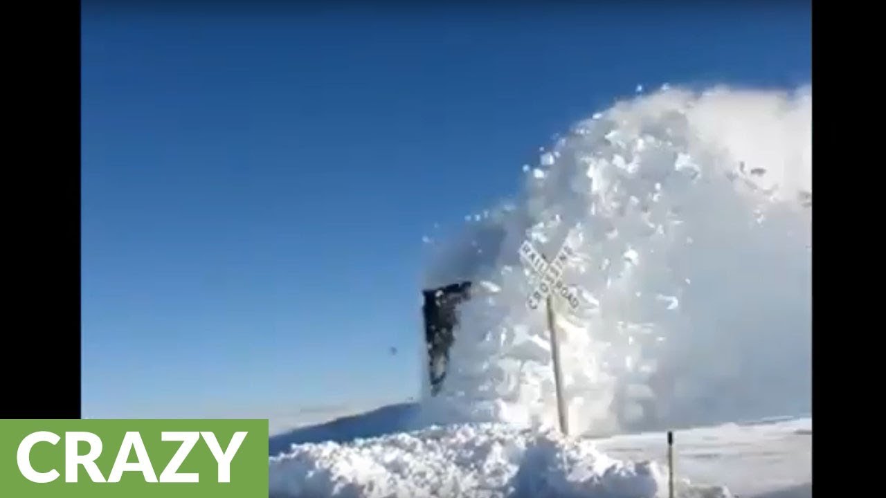 Train plows through heavy snow, results in stunning footage - YouTube