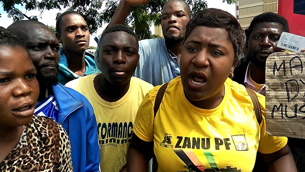 Zanu-PF members protest against Kazembe at party Manifesto launch - YouTube