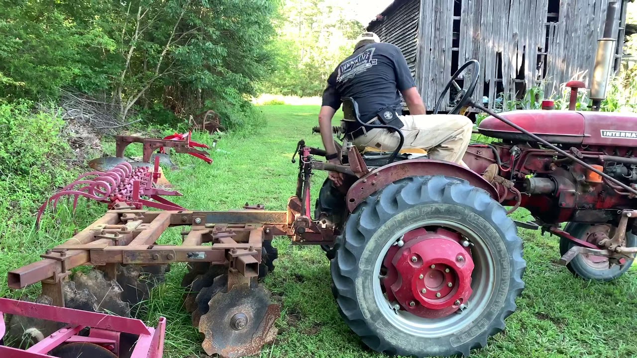 Farmall 140 Disking 2021 Corn Ground - YouTube