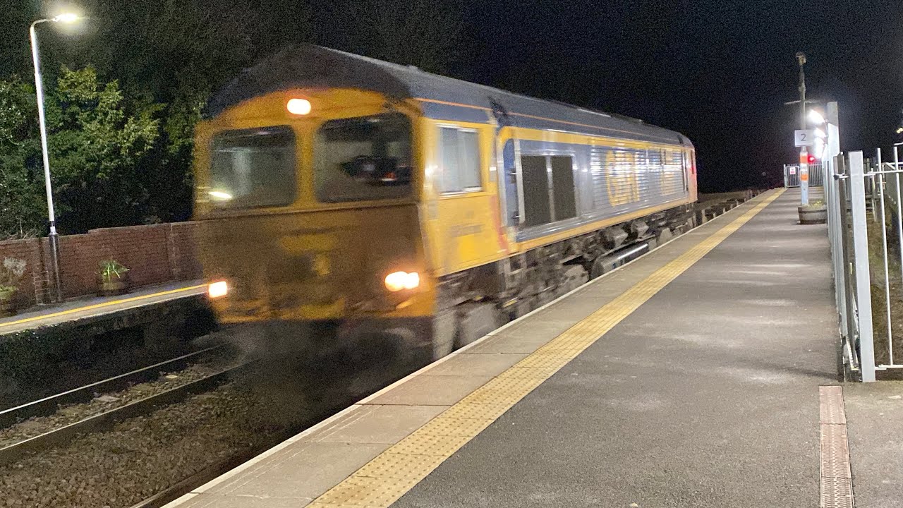 “Sir Sam Fay” 66707 GBRf 4D79 with a rake of empty container flatbeds ...