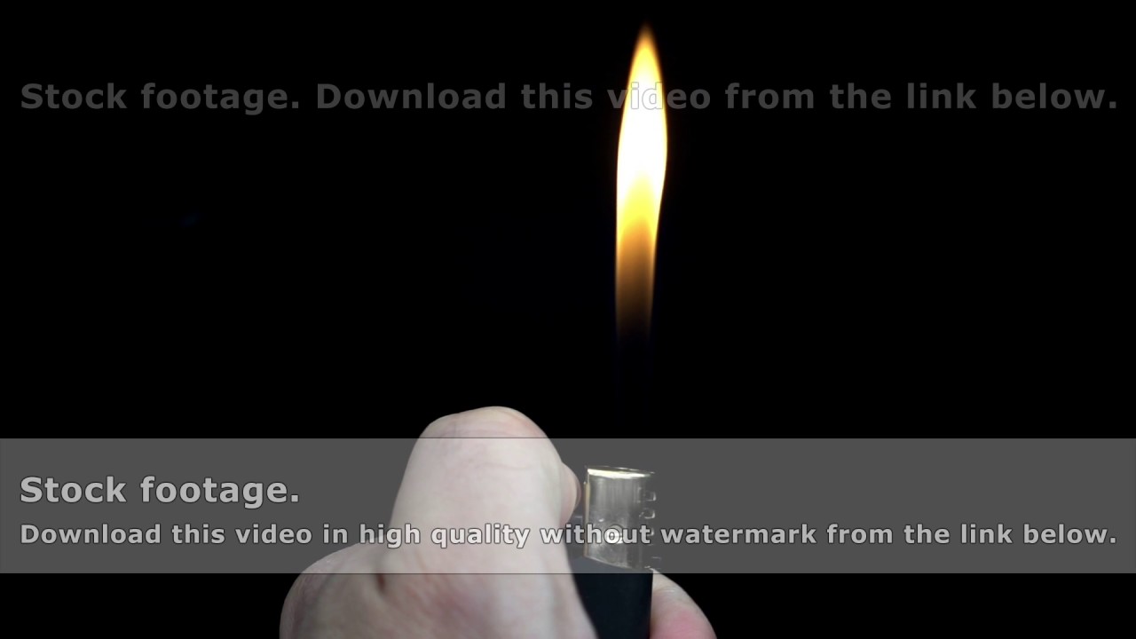 Hand light the lighter fire on black background - YouTube