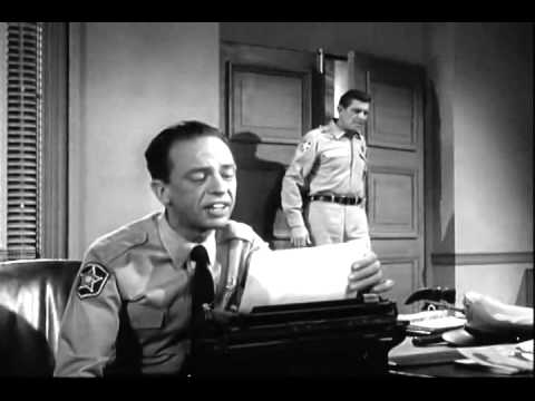 Barney is writing a song, doesn't know Andy is standing behind him