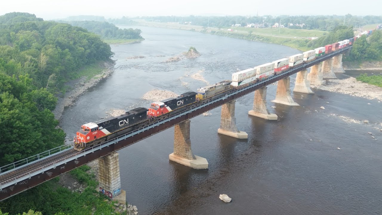 Awesome Aerial 4K View! Huge Stack Train CN 121 Crossing Bridge near ...
